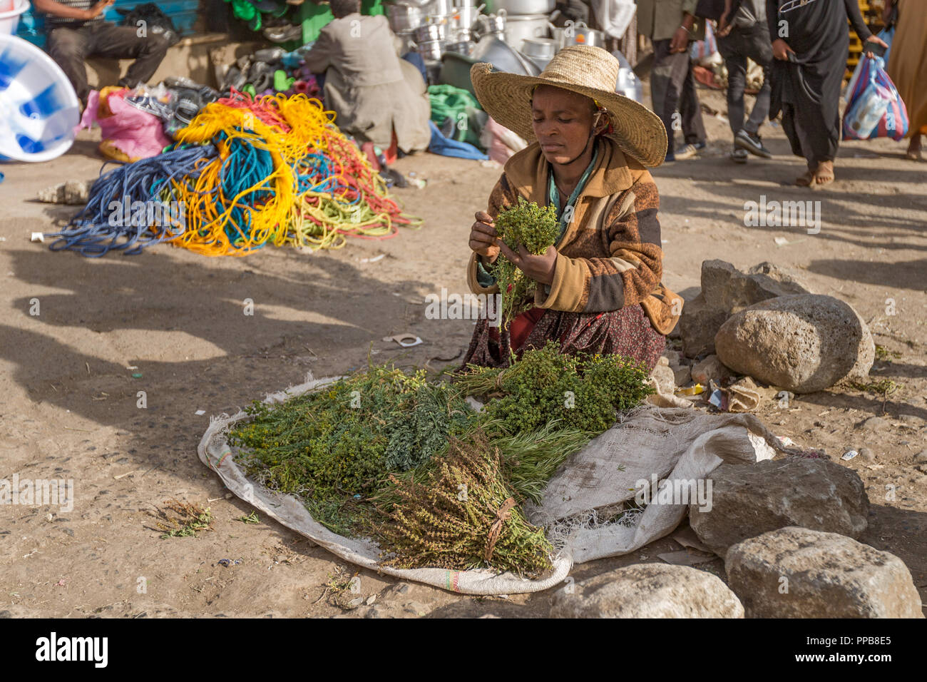 Woman selling herbs, Addis Ketema aka Merkato, the largest African open ...
