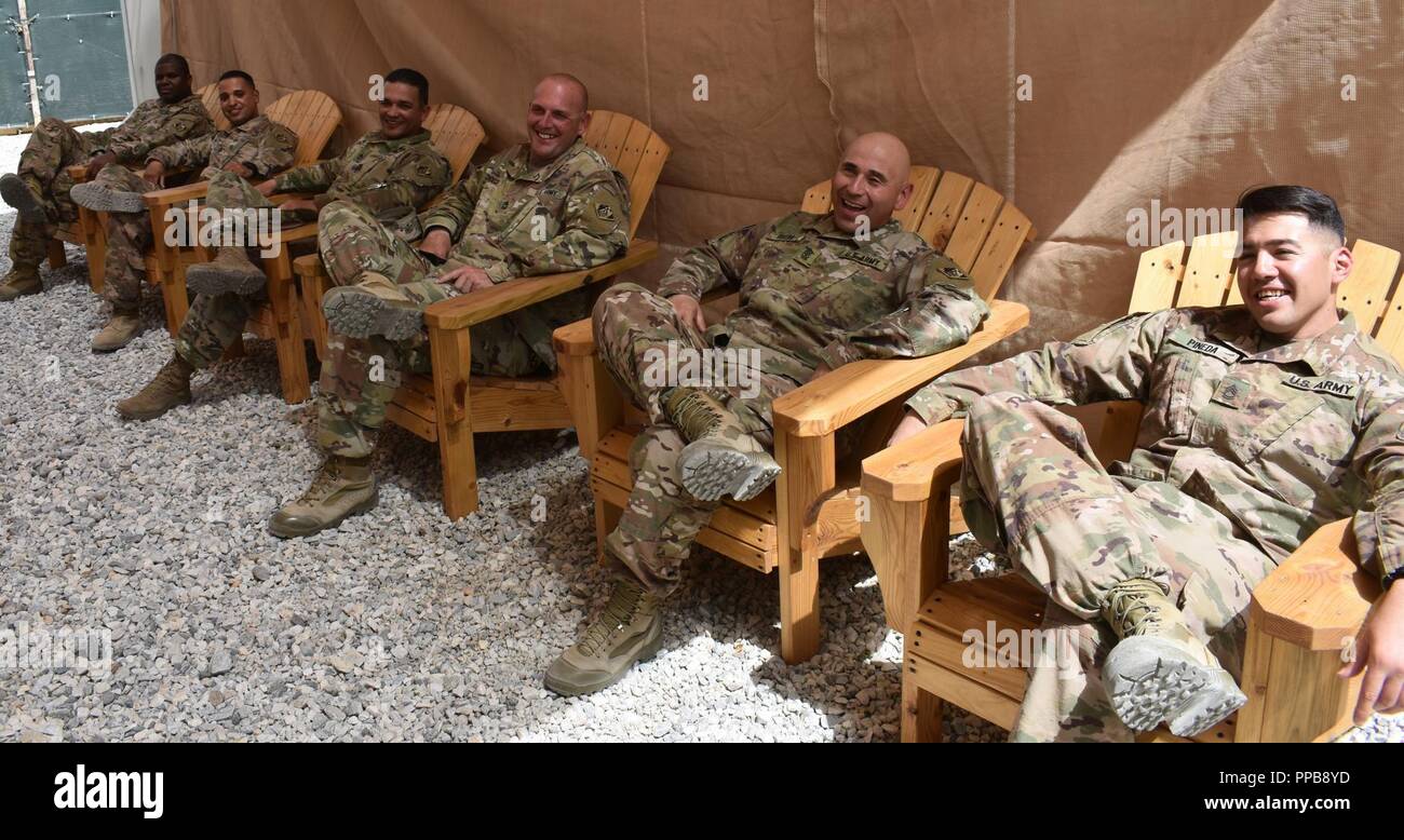 Synchronized non-commissioned officers share a moment in the big seats ...