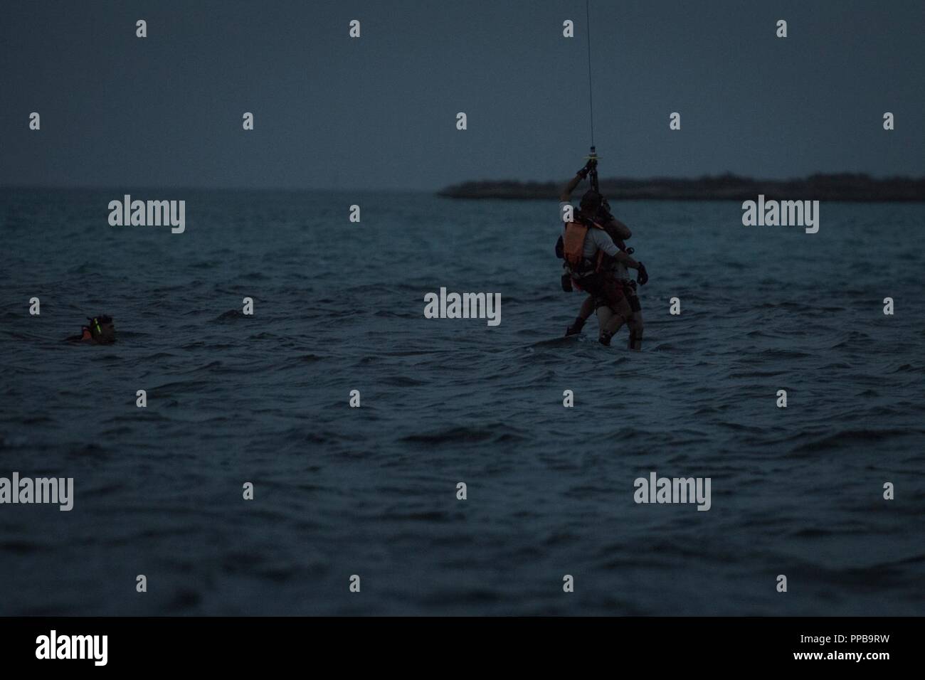 A French Air Force rescue diver, hoist up a simulated survivor from an ...