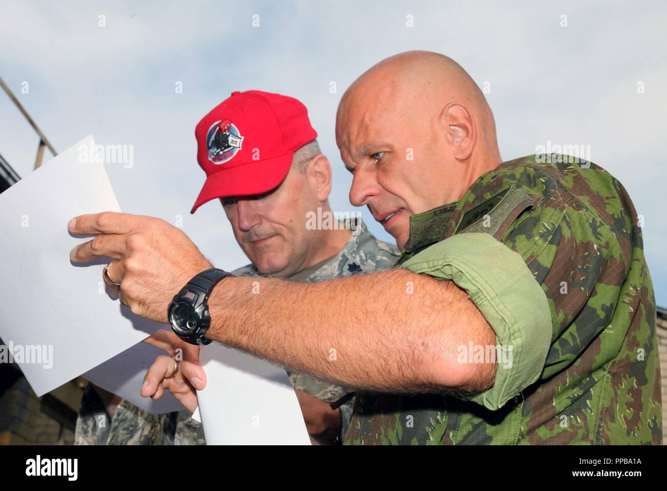 Lt. Col. John Hayes of the 201st RED HORSE Squadron and Maj. Kestutis ...