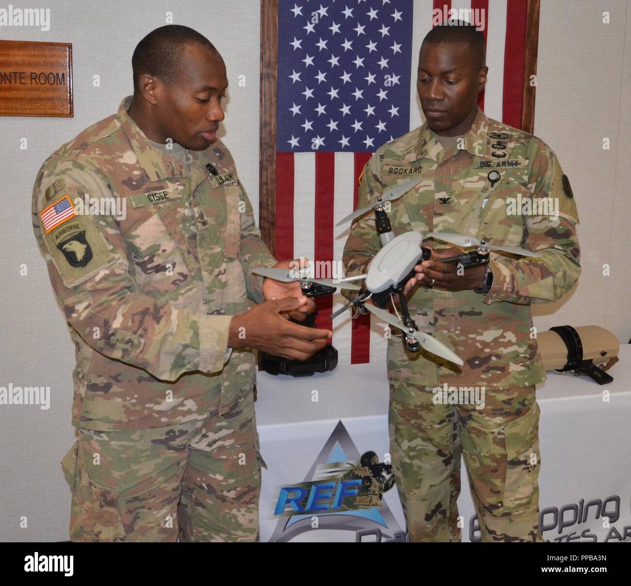 Col. Joe Daniels Bookard, right, examines the InstantEye aerial vehicle ...