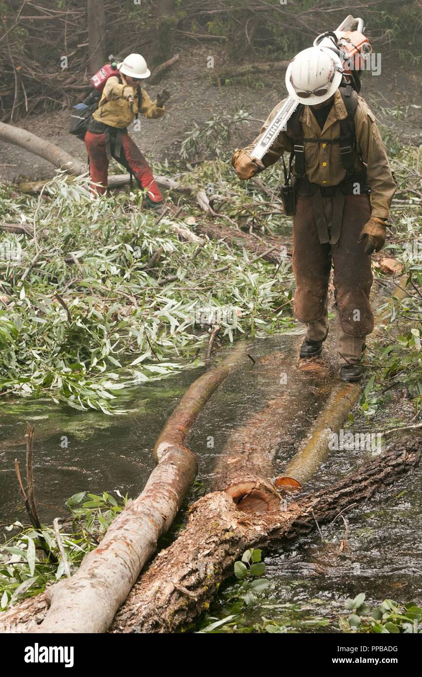 Two Aravaipa hand crew sawyers cross the Russian River, August 16, 2018 ...