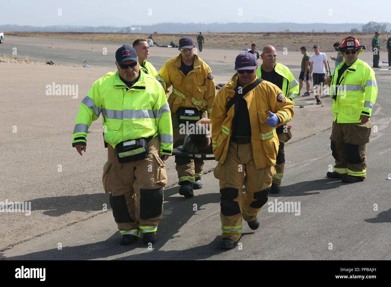 Firefighters with the Marine Corps Air Station Miramar Fire Department ...