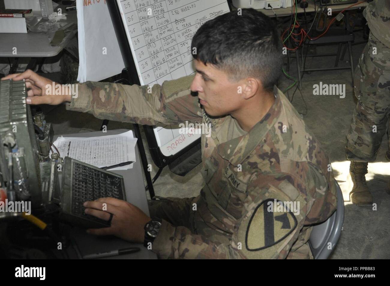U.S. Army Pvt. Neil Walley, an operations Soldier assigned to the 2nd ...