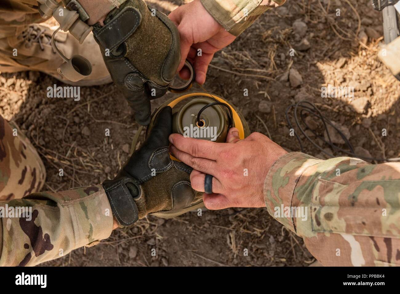 Task Force Raider combat engineers prime a 15-pound shape charger ...