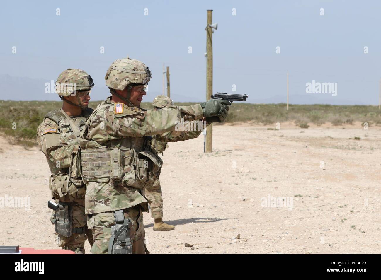 An Iron Soldier assigned to the 1st Armored Division takes aim using an ...