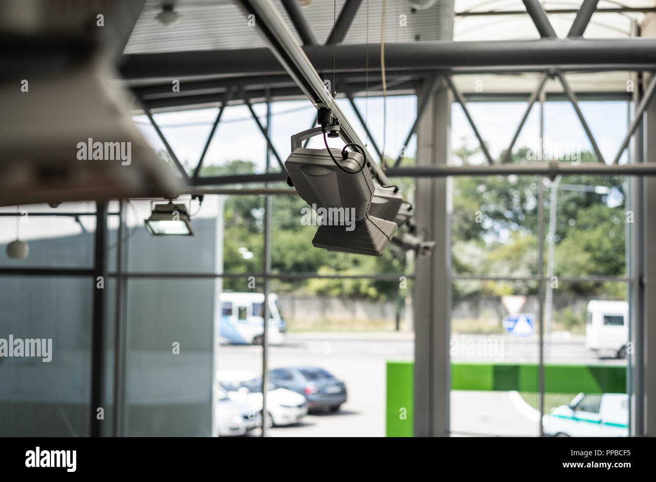 Spotlight hang from the ceiling in the exhibition hall Stock Photo - Alamy
