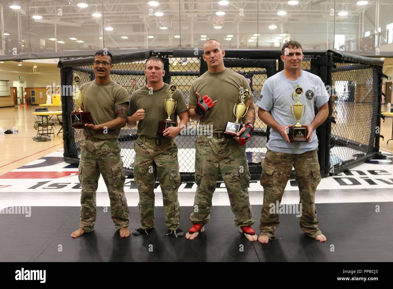 Winners of the two-day division-wide combatives tournament pose with ...