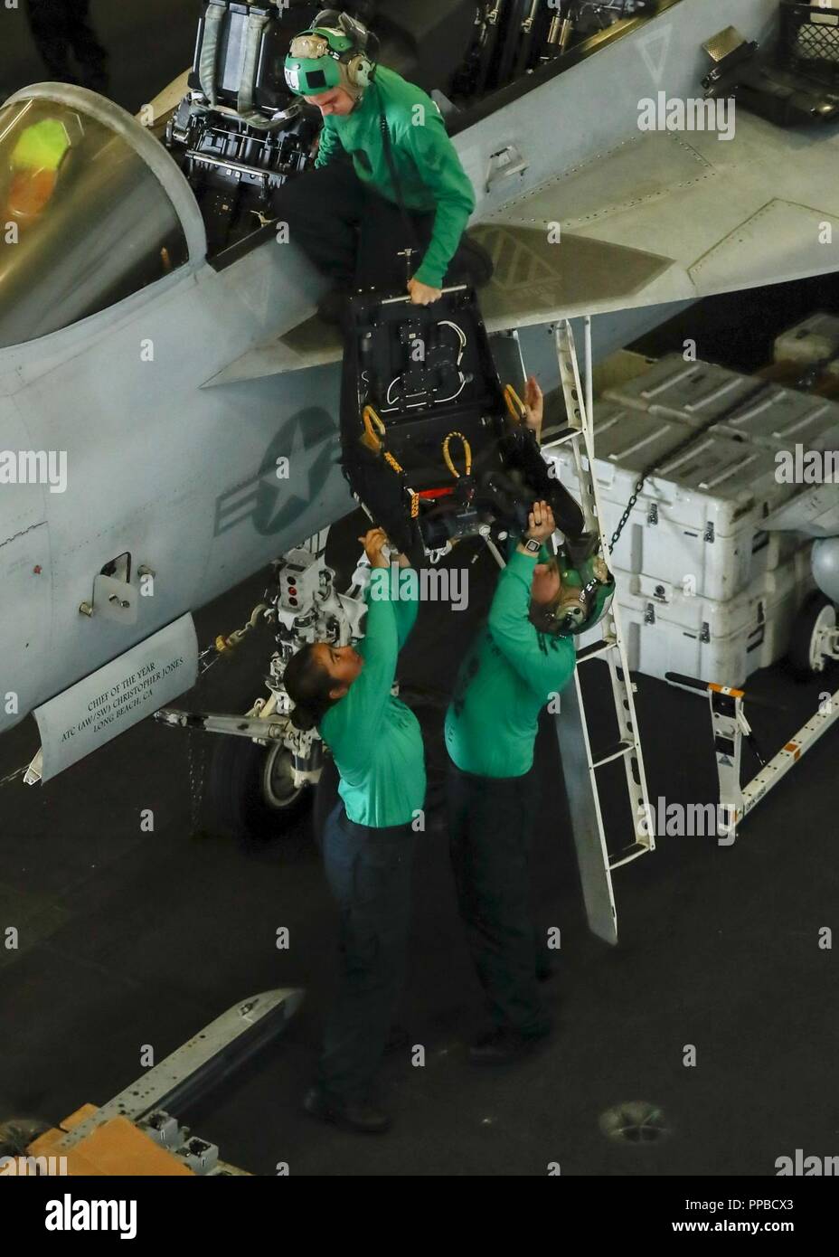 OCEAN (Aug. 20, 2018) Sailors remove an ejection seat pocket from an F ...