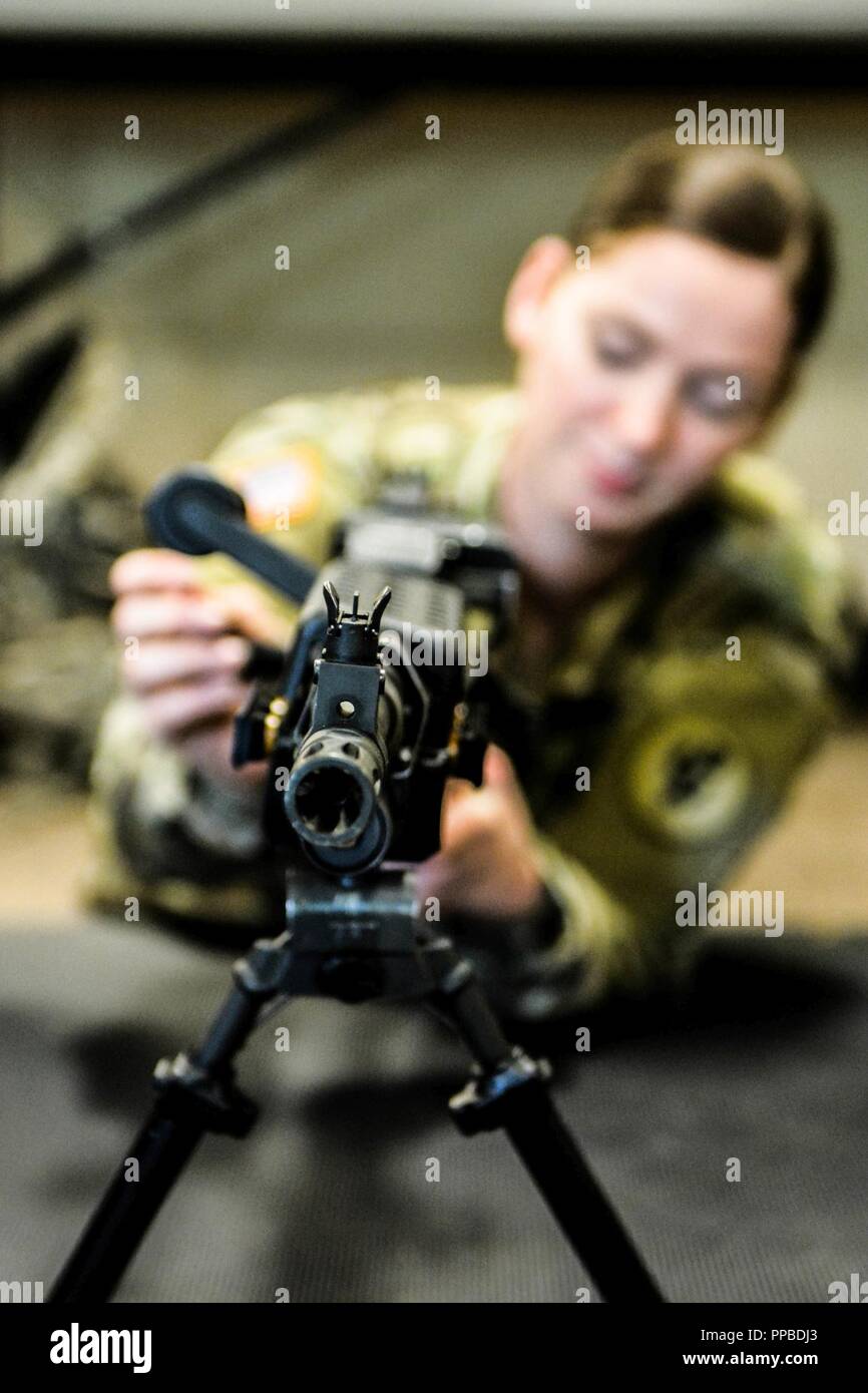 A U.S. Army Reserve Soldier demonstrates clearing an M240B machine gun ...