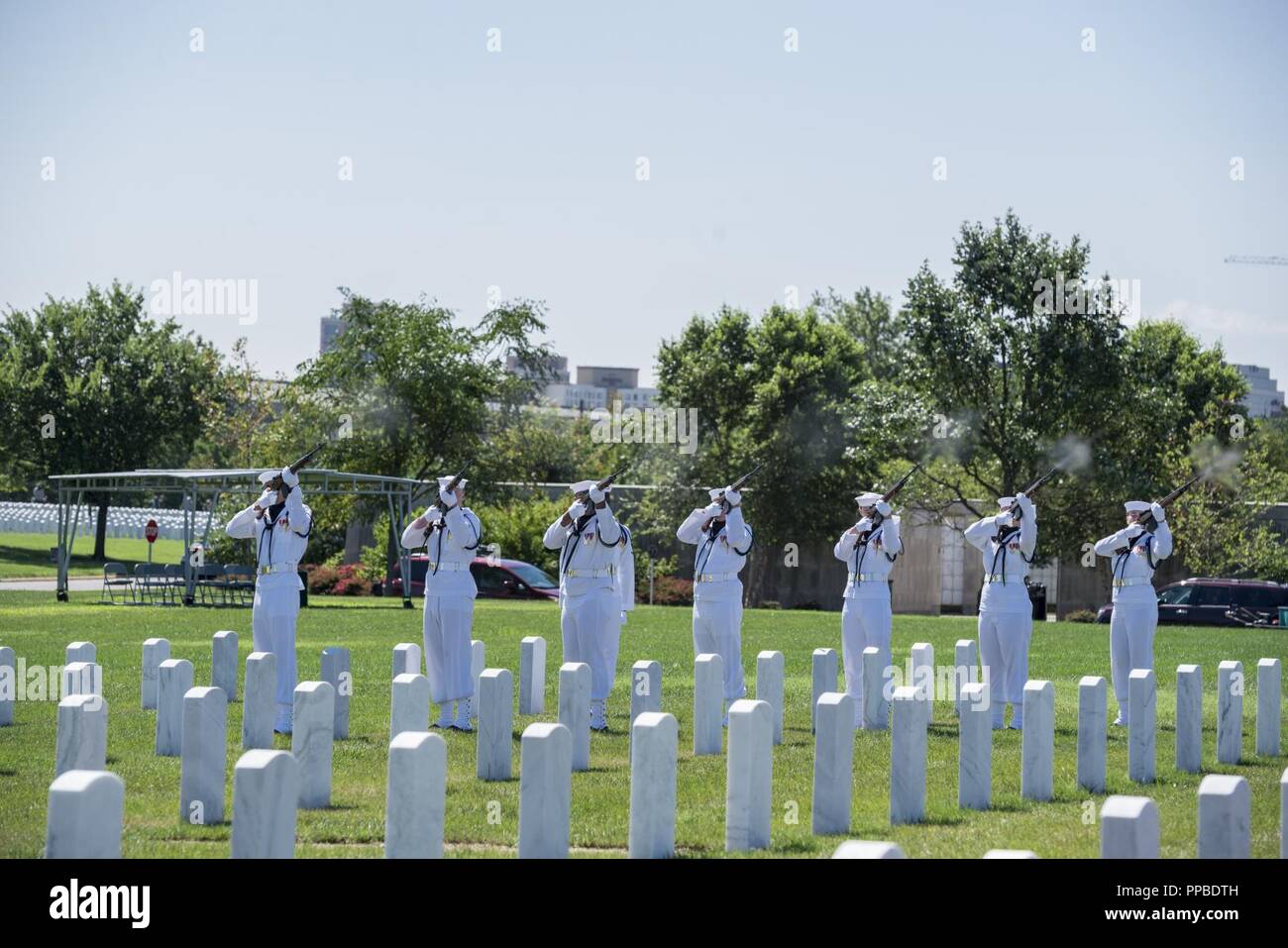 The U.S. Navy Ceremonial Guard firing party fires a 3-rifle volley ...