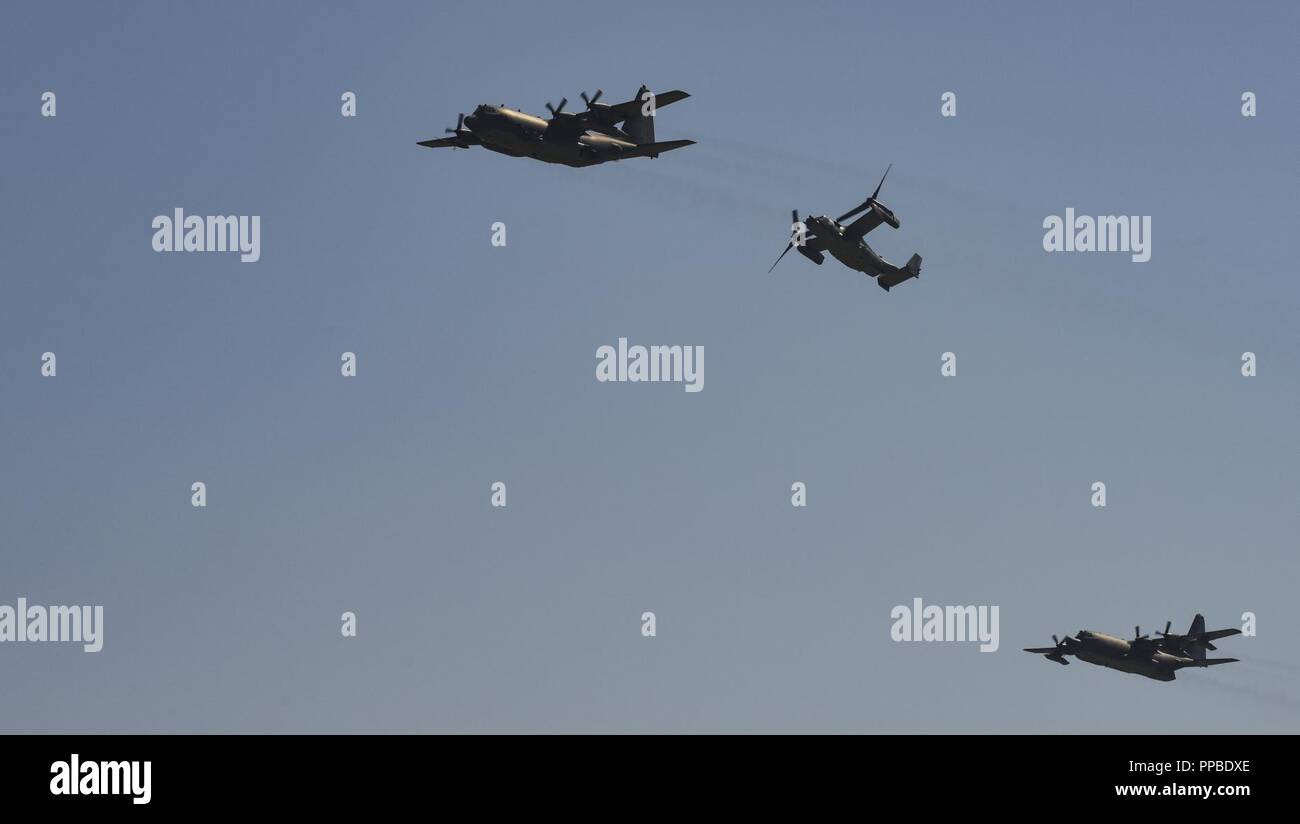 An AC-130U Spooky gunship, MC-130H Combat Talon II and two CV-22 Osprey ...