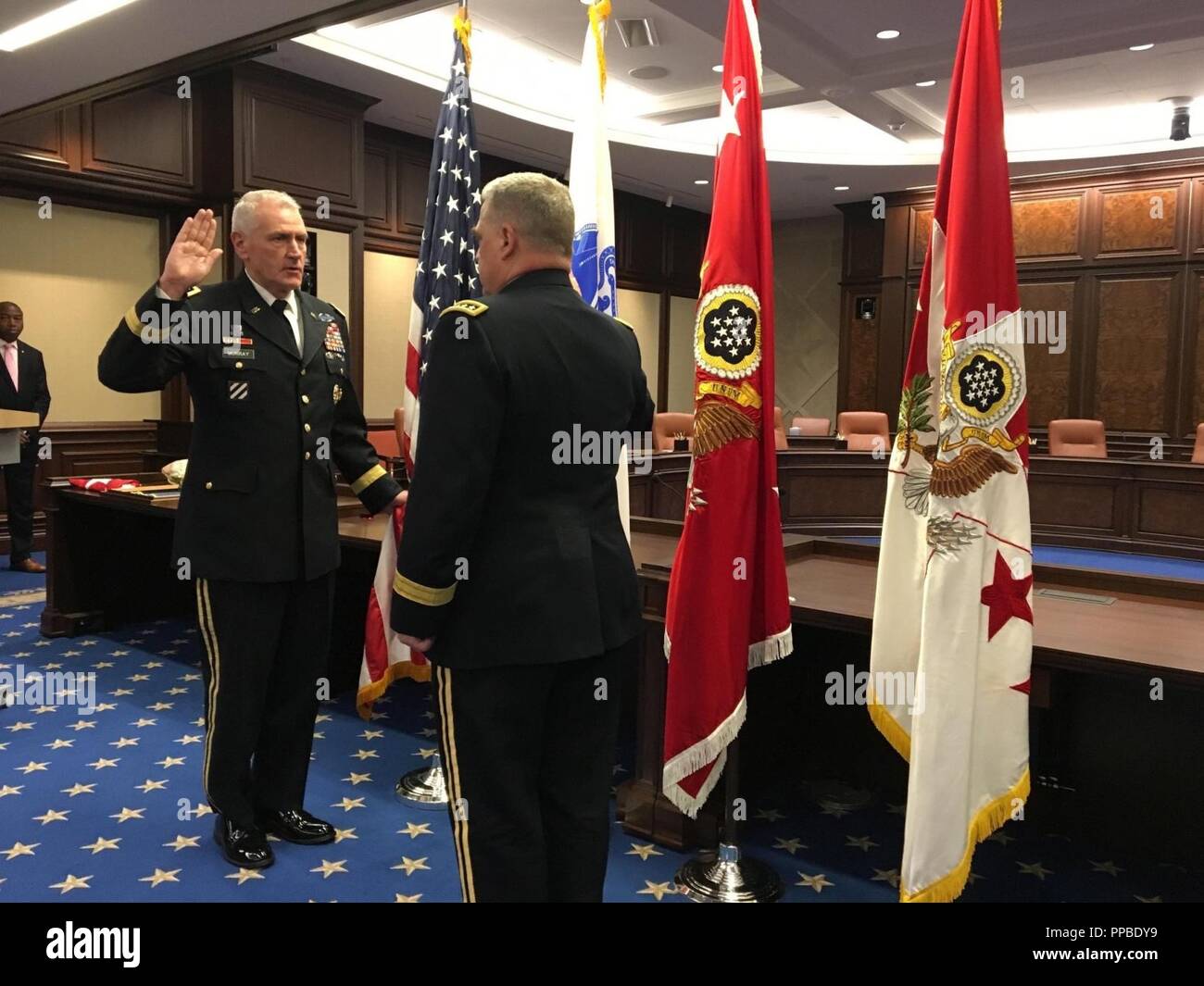 Gen. John M. Murray recites the commissioned officer oath of office ...