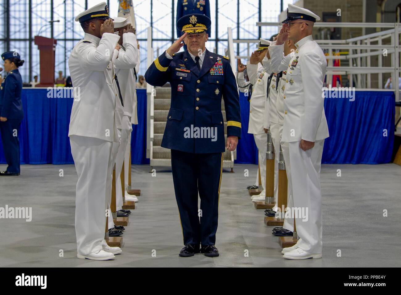 U.S. Army Gen. Stephen R. Lyons salutes a detail of sailors after ...