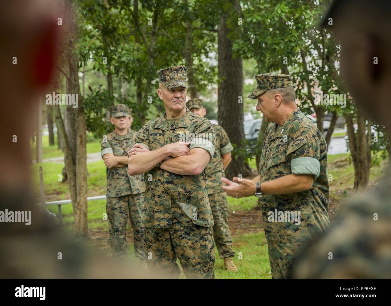 U.S. Marine Brig. Gen. Karsten Heckl and Col. Paul Baker, cut the ...