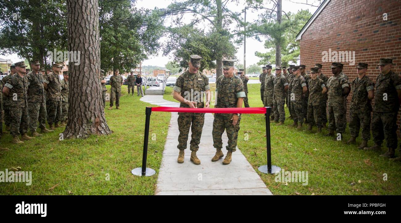 U.S. Marine Brig. Gen. Karsten Heckl and Col. Paul Baker, cut the ...