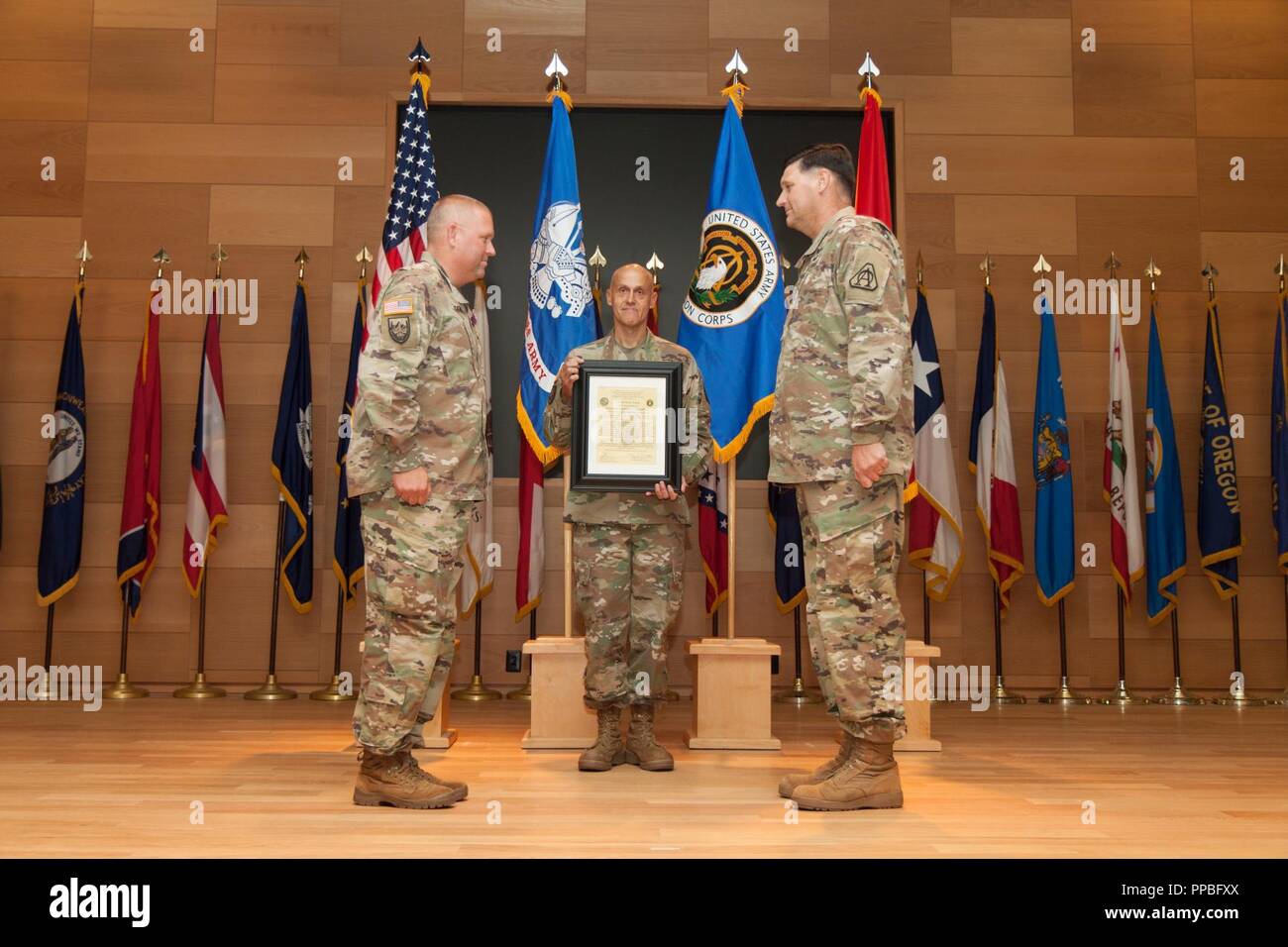 Maj. Gen. Kirk Vollmecke, center, the Program Executive Officer for ...