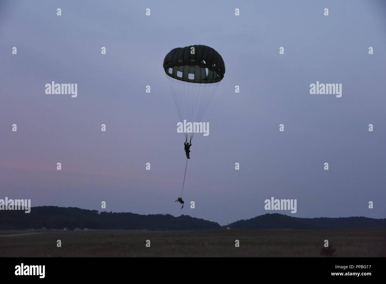 Marines perform a static line jump from an AC-130 at Fort McCoy, Wis ...