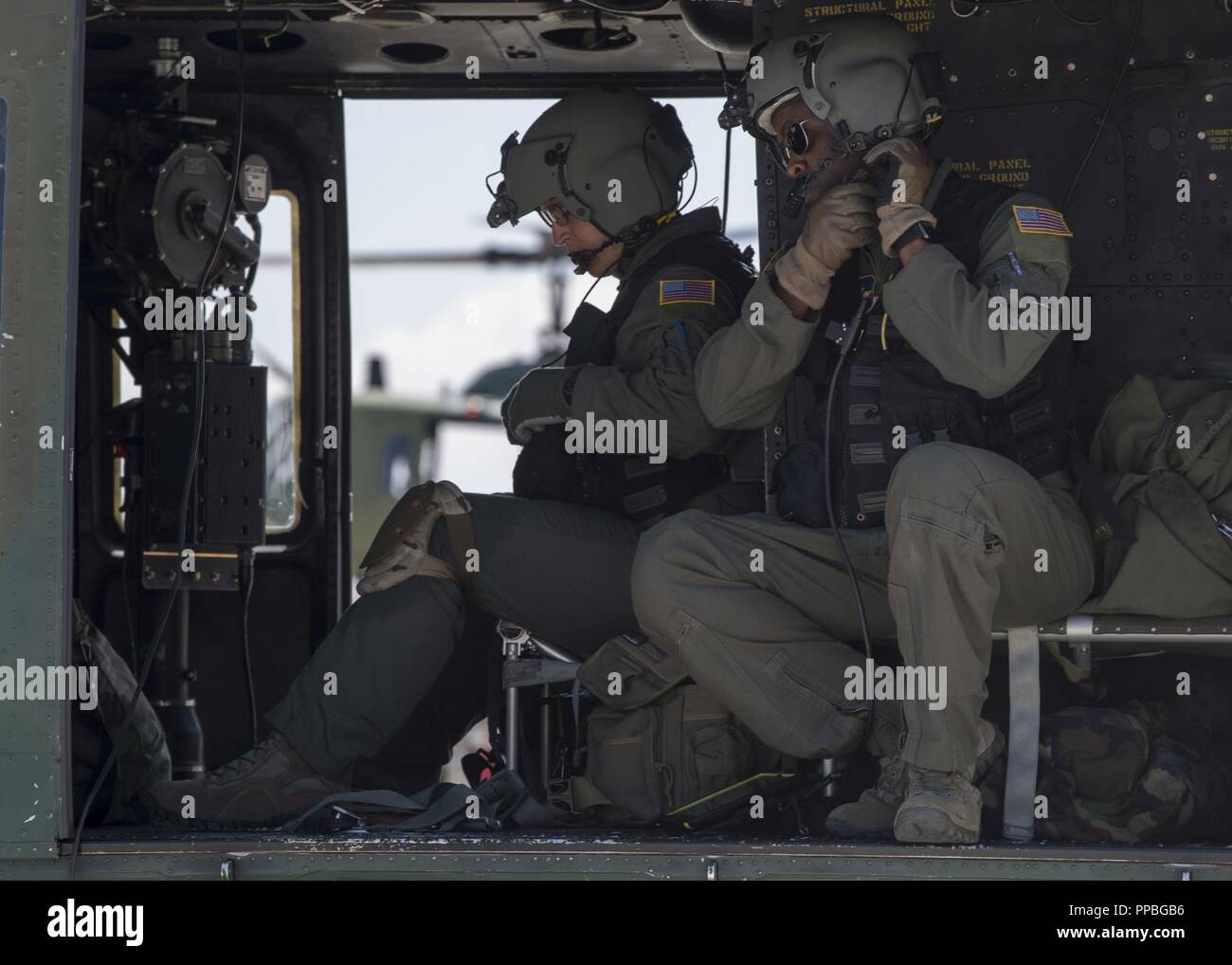 Members of the 58th Training Squadron perform pre-flight checks on a UH ...