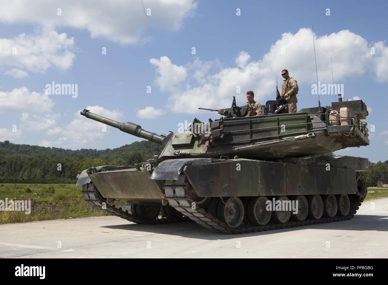 A crew of Marines from 1st Tank Battalion position the M1A1 Abrams tank ...