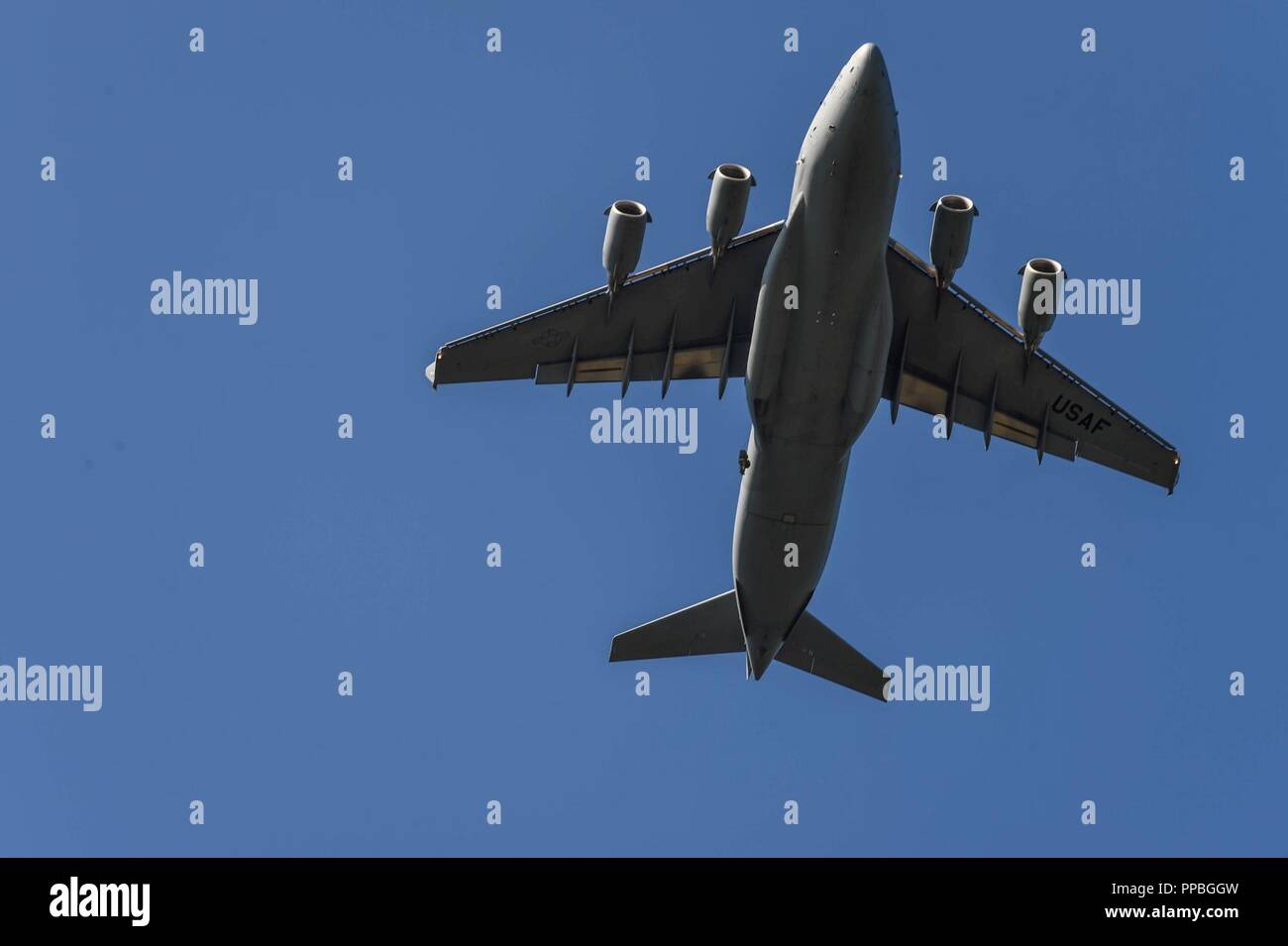 A C-17 Globemaster III from McChord Field, Wash., flies over the ...
