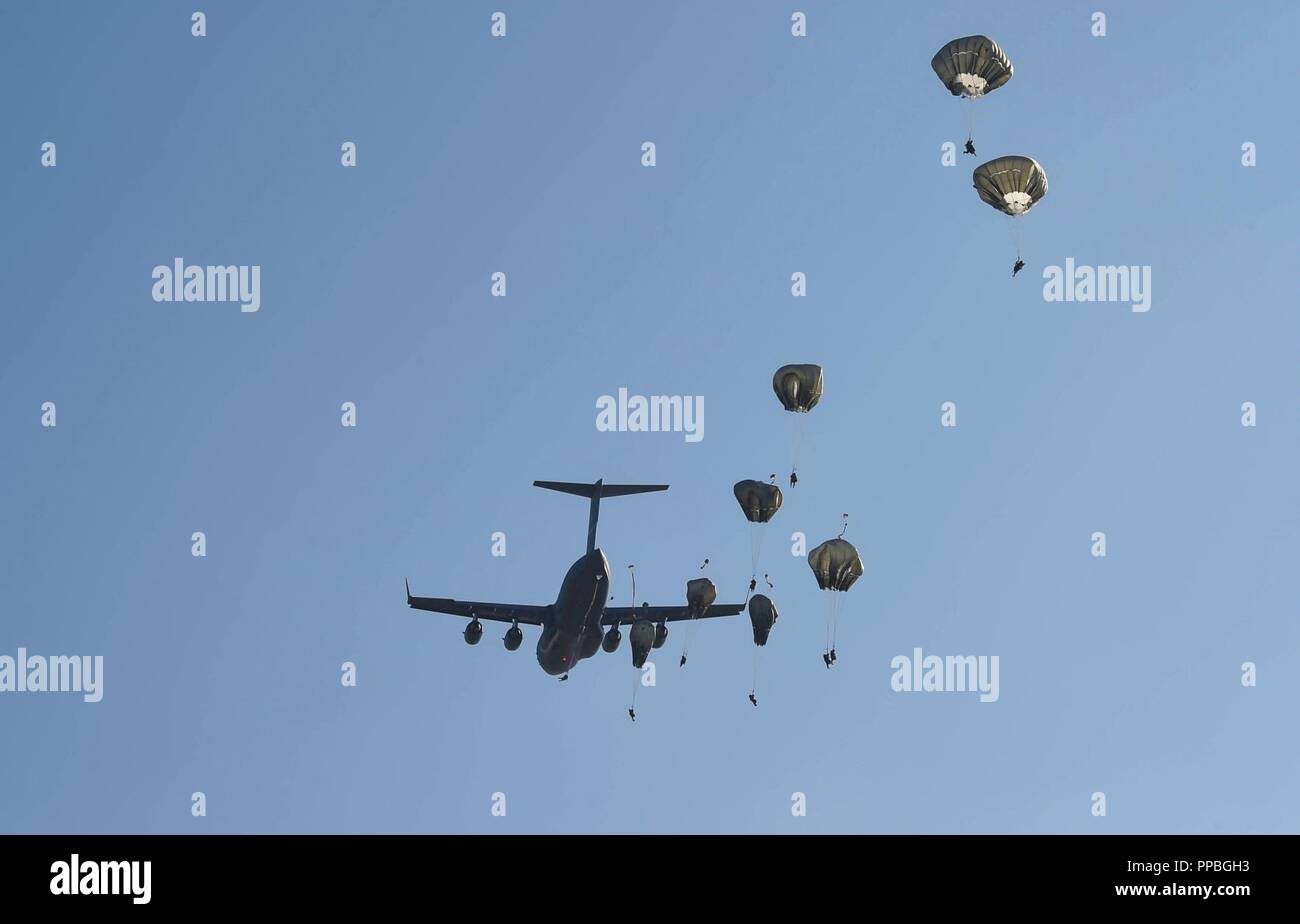 Paratroopers from the 82nd Airborne Division jump from a C-17 ...