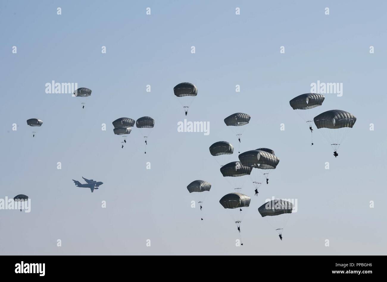 Paratroopers from the 82nd Airborne Division jump from a C-17 ...
