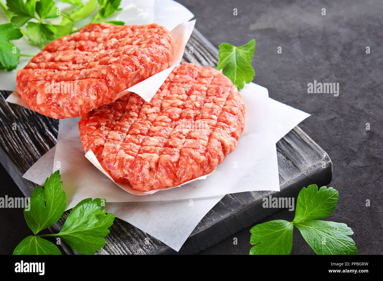 Raw minced meat for home made grill burgers cooking with spaces and ...