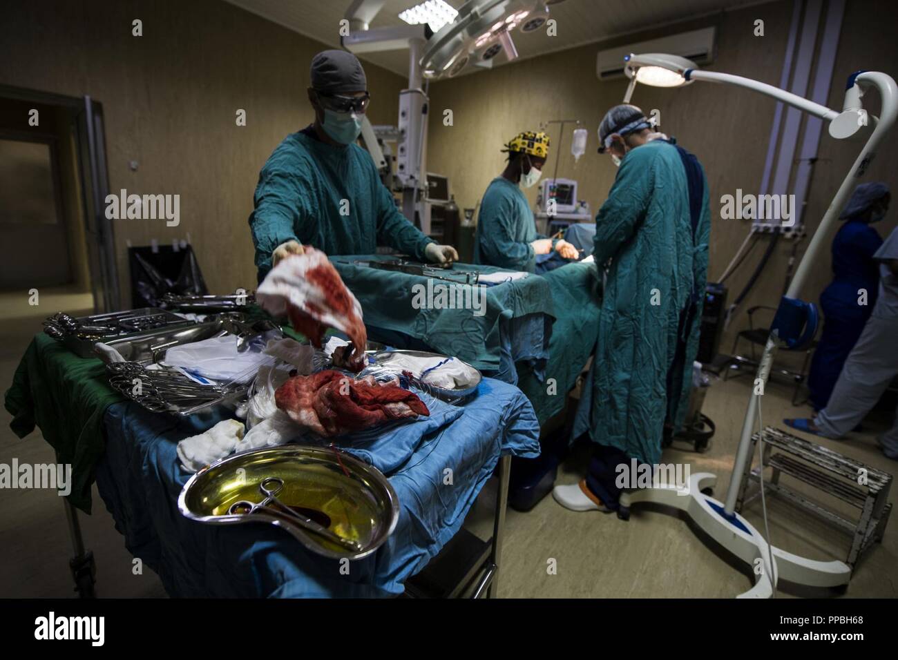U.S. Army Sgt. Anthony Triolo, an operating room specialist assigned to ...