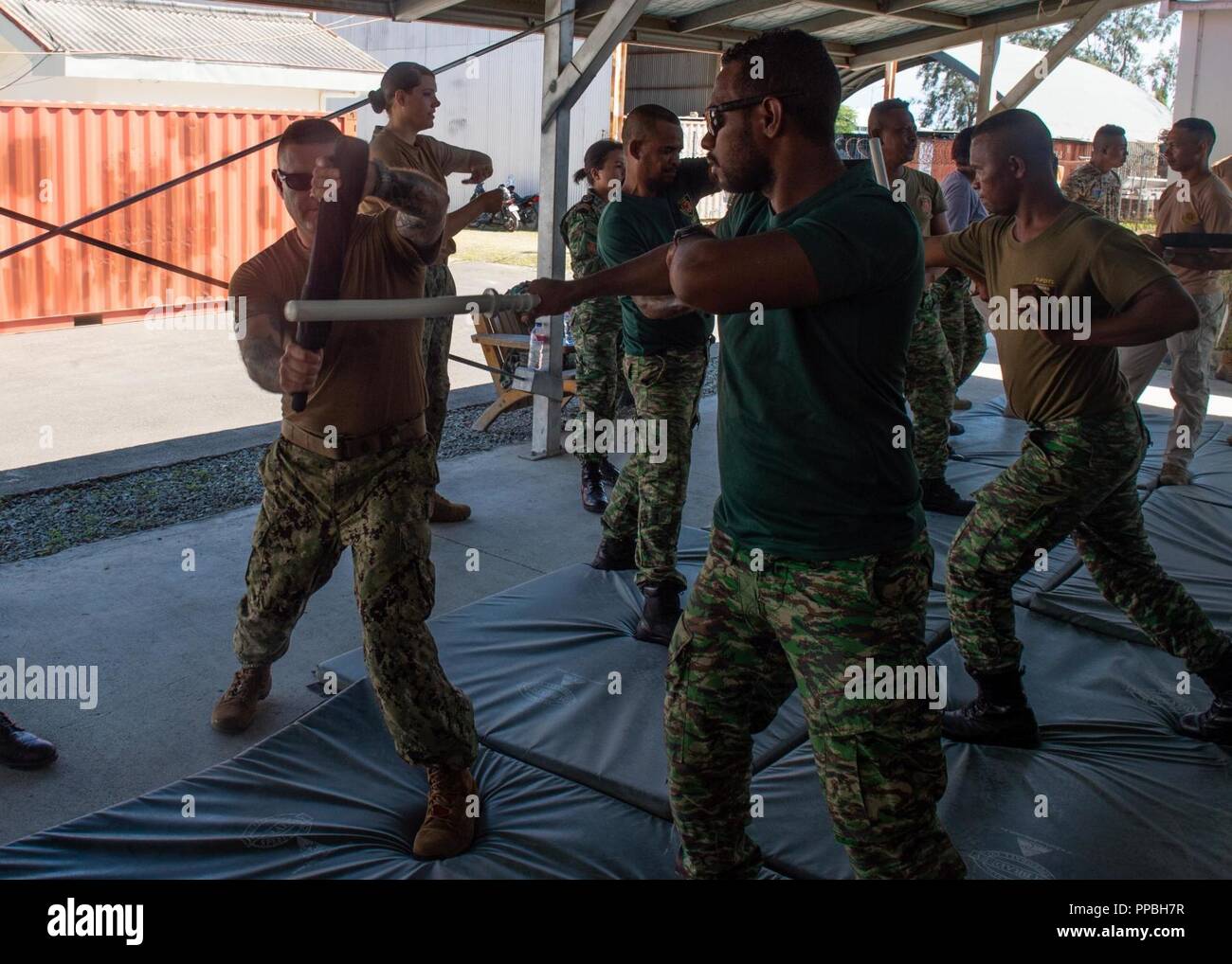Sailors assigned to Coastal Riverine Group (CRG) 1 Det. Guam, and ...
