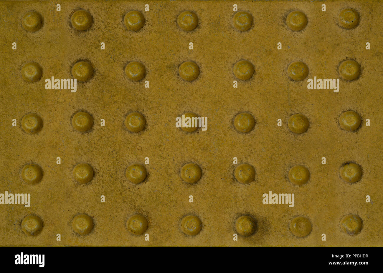 Weathered and soiled yellow metal with bumps Stock Photo - Alamy