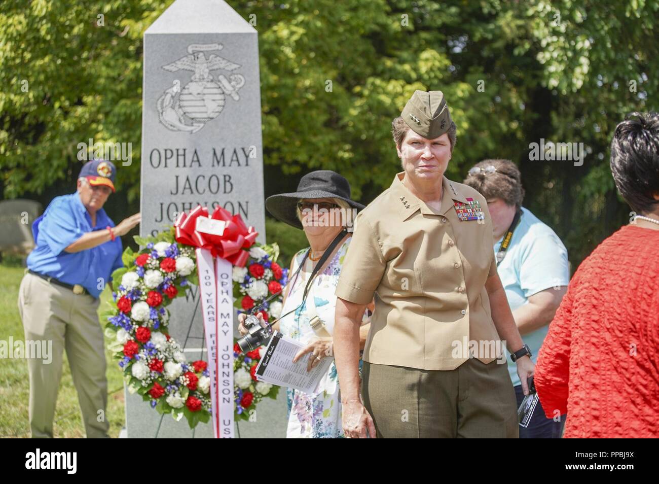 Guest visit a monument at the gravesite of Opha May Johnson, St. Paul’s ...