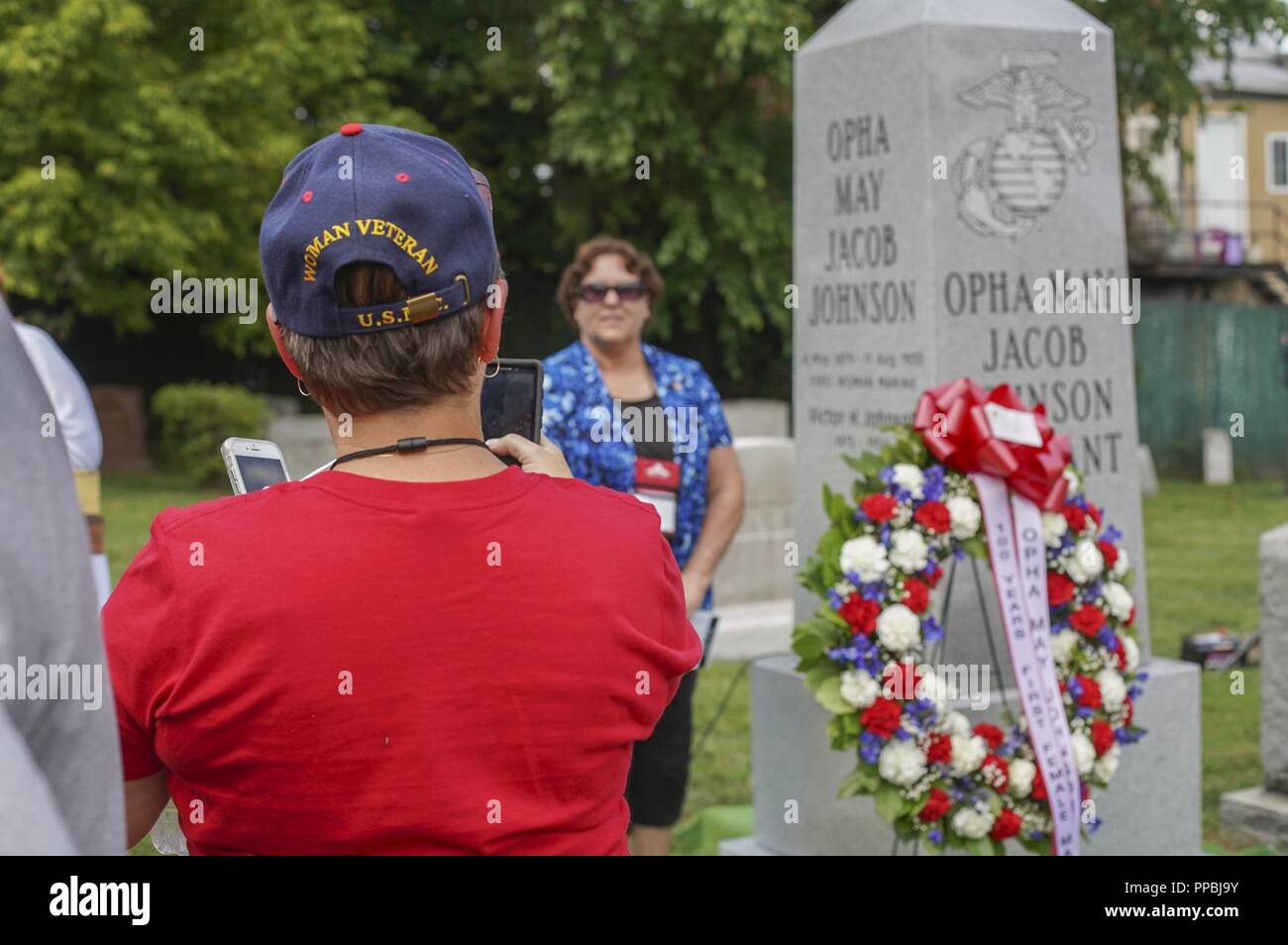Guest visit a monument at the gravesite of Opha May Johnson, St. Paul’s ...