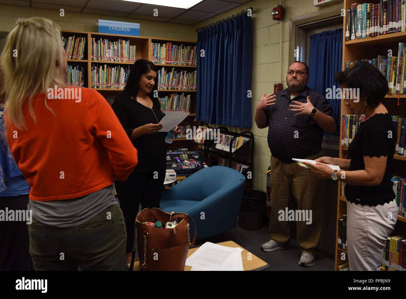 John Crawford, 8th Fighter Wing librarian, briefs Sharene Brown, wife ...