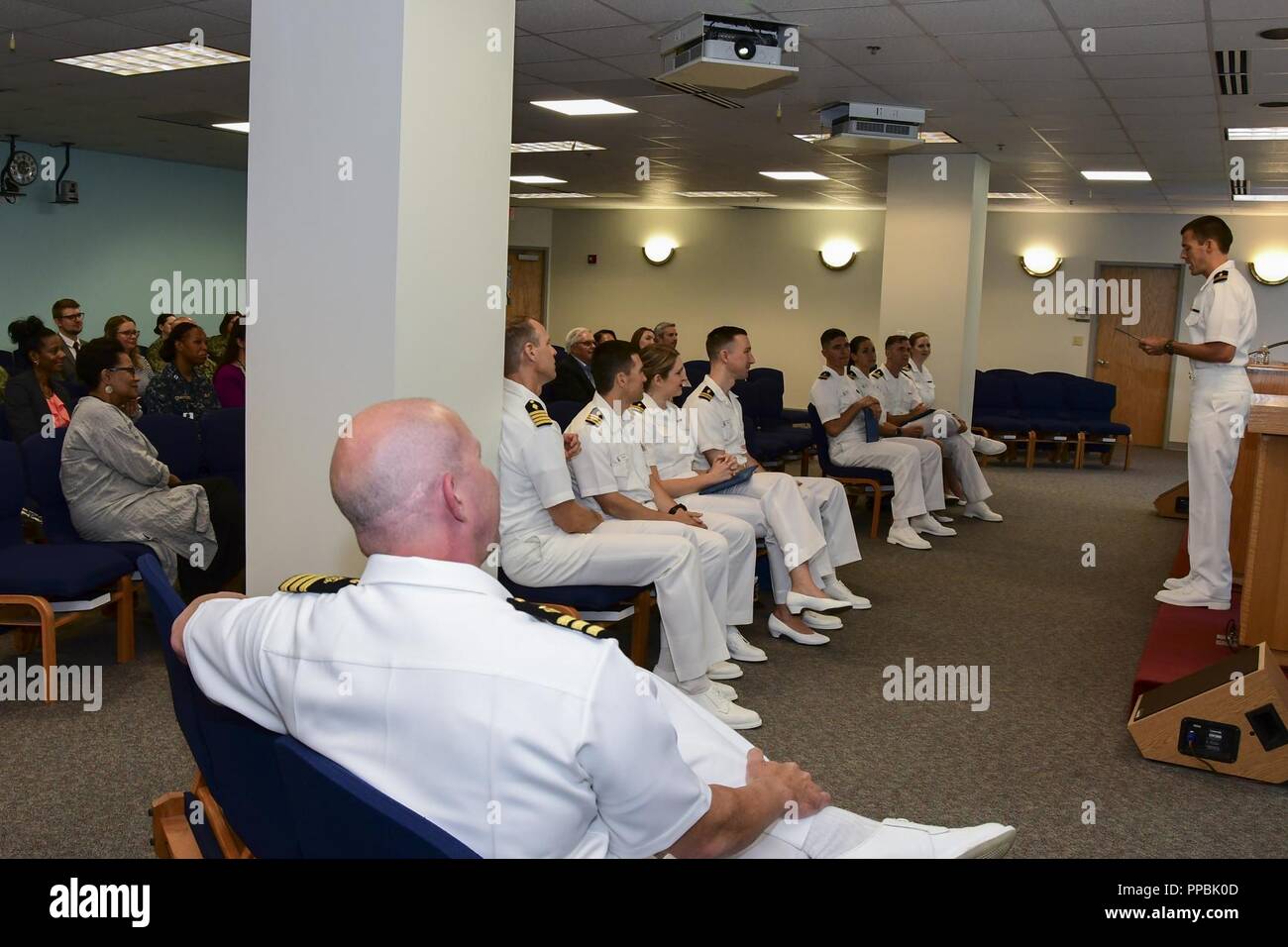 Lt. John Mallory addresses the graduating class and guests during the ...