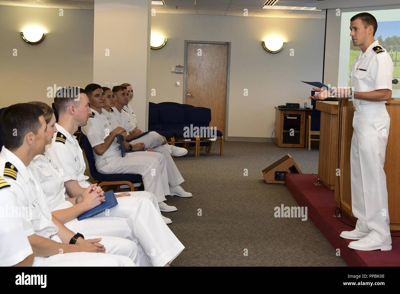 Lt. John Mallory addresses the graduating class and guests during the ...