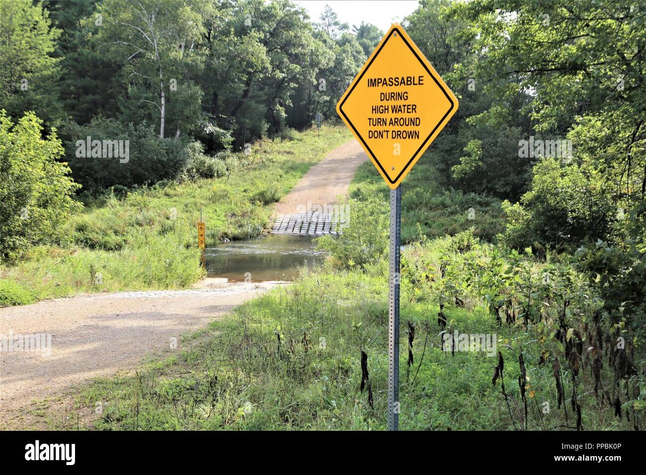 A sign indicating a warning for a water crossing is shown Aug. 28, 2018 ...