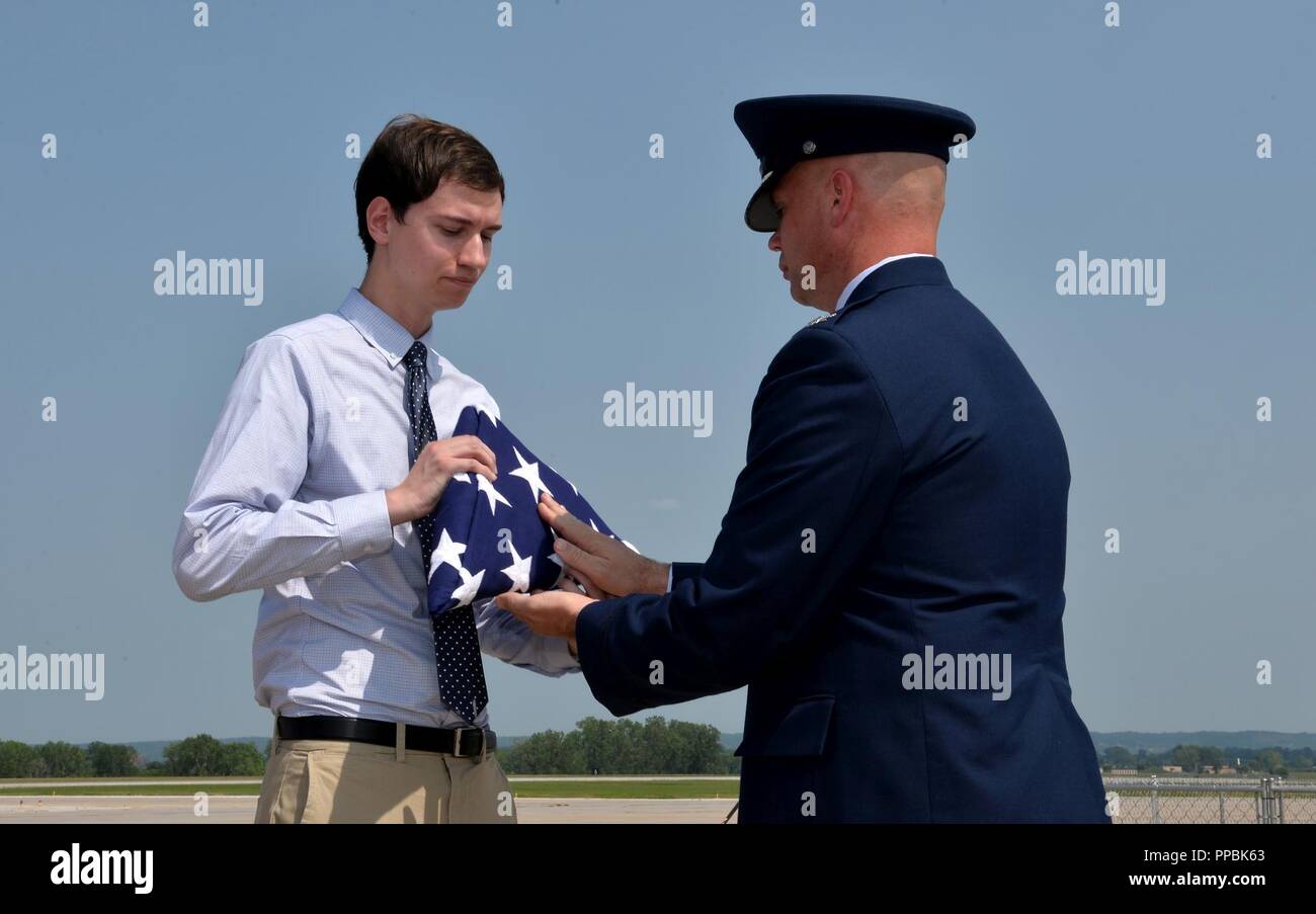 Col. Michael Manion, 55th Wing commander, hands John Offutt an American ...