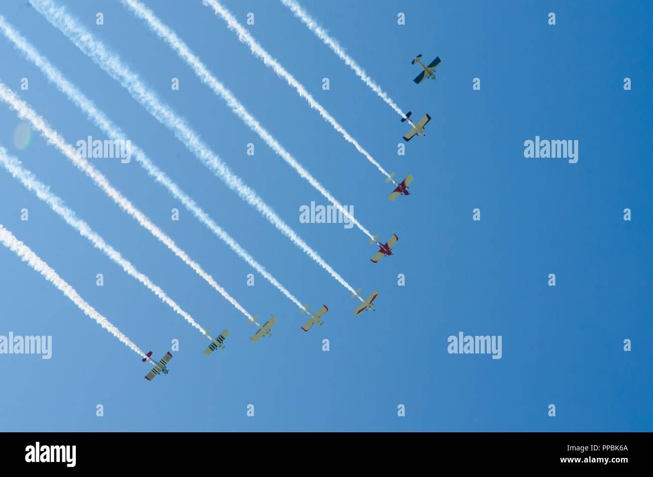 A formation of civilian single-engine aircraft, flown by the Kansas ...