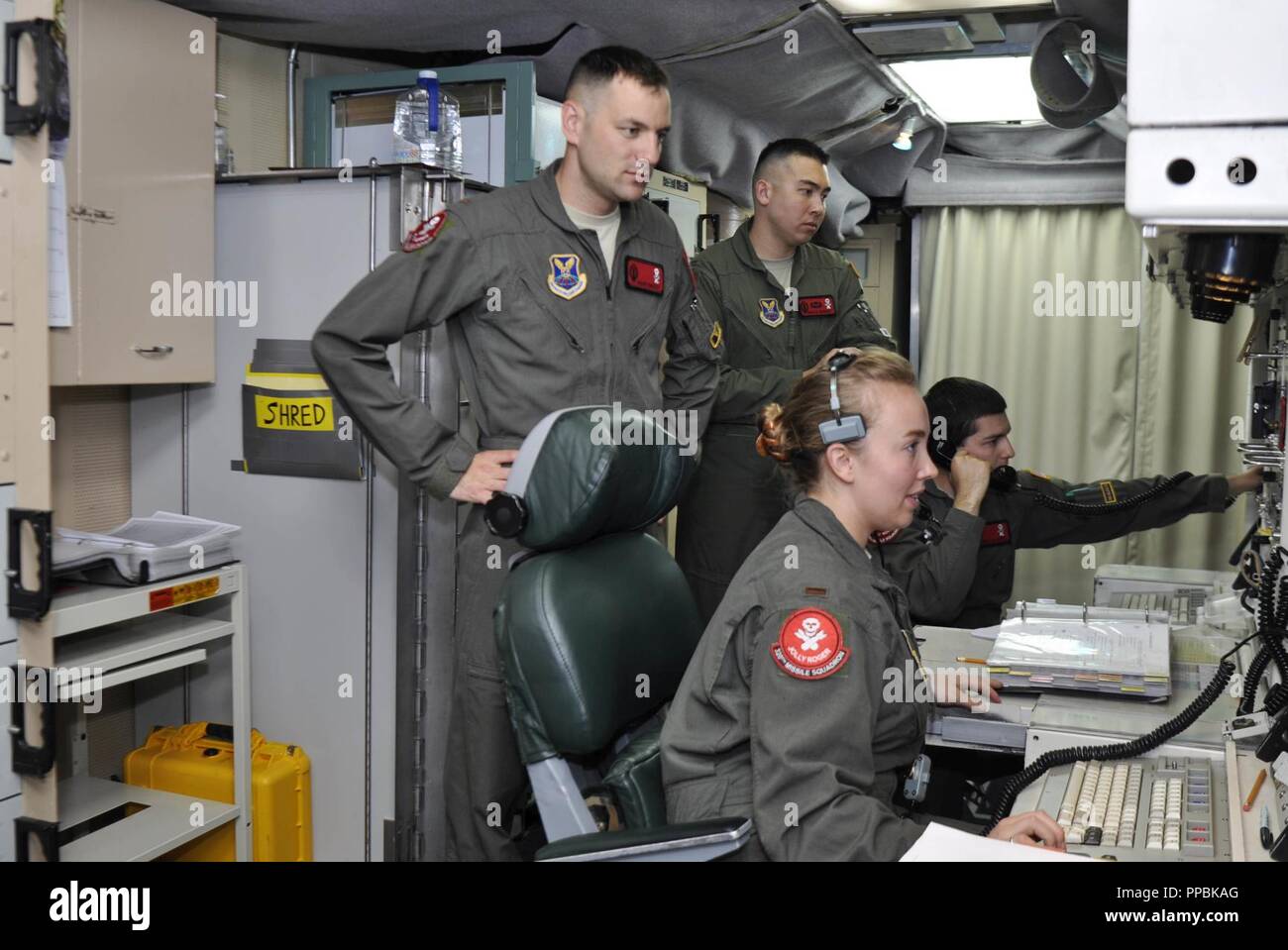 Missileers with the 320th Missile Squadron monitor screens in a launch ...