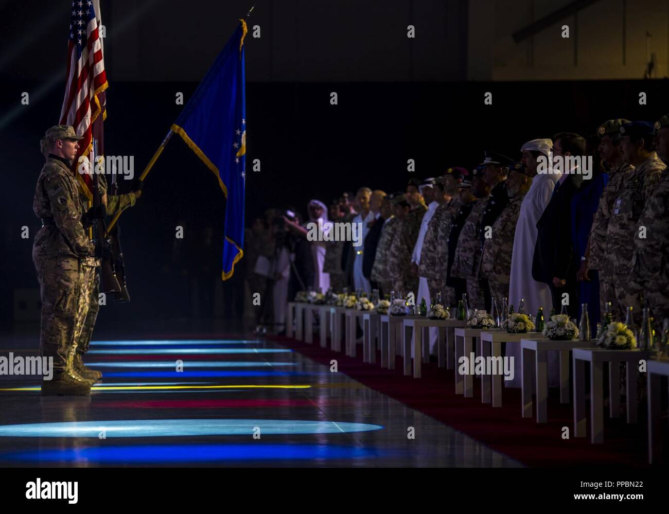 Members of Al Udeid Air Base Honor Guard present the colors during the ...