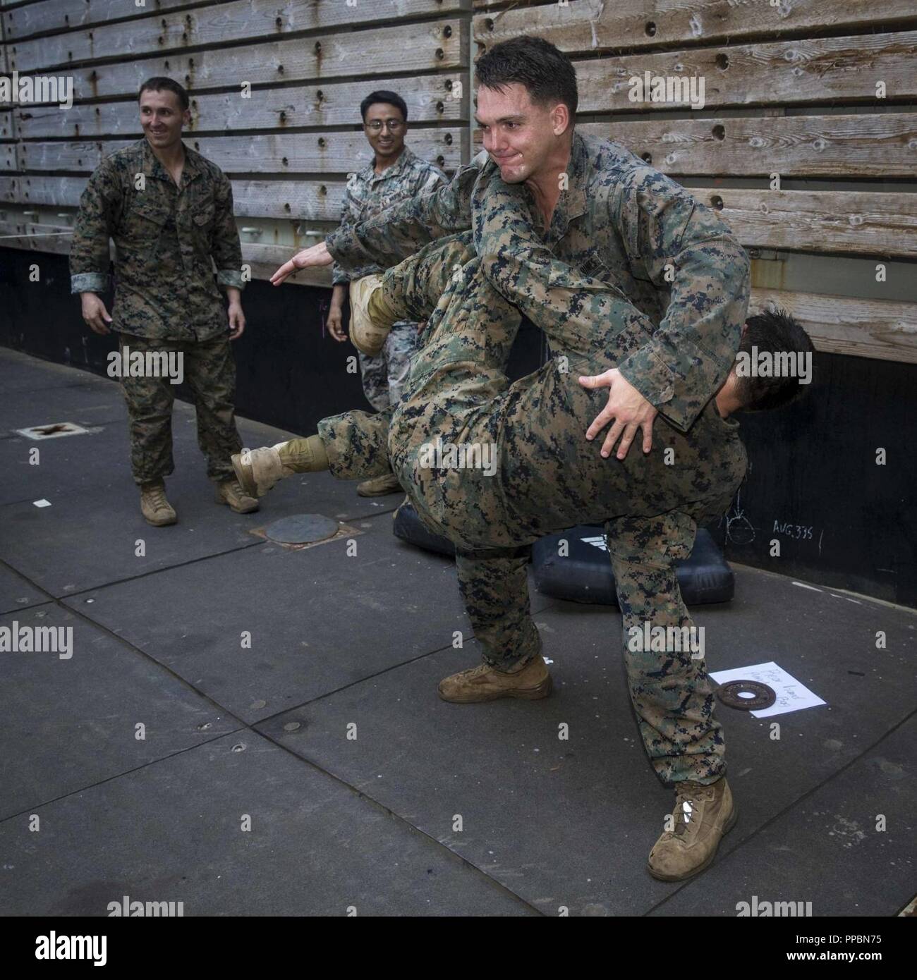 INDIAN OCEAN - U.S. Marine Cpl. John Hooper, braces himself as Sgt ...