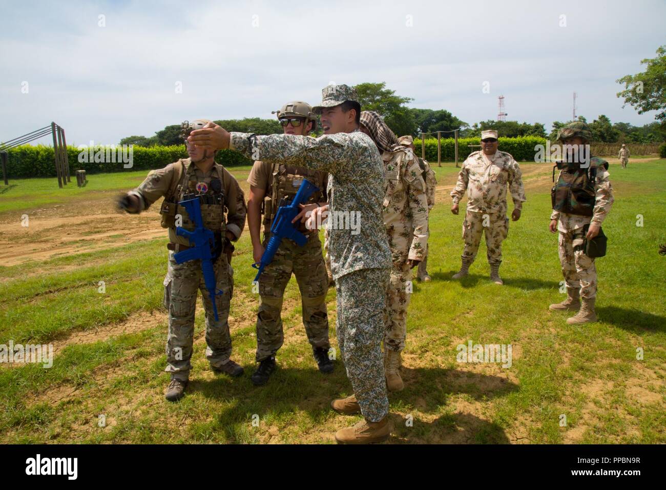 U.S. Navy Explosive Ordnance Disposal Technicians, assigned to ...