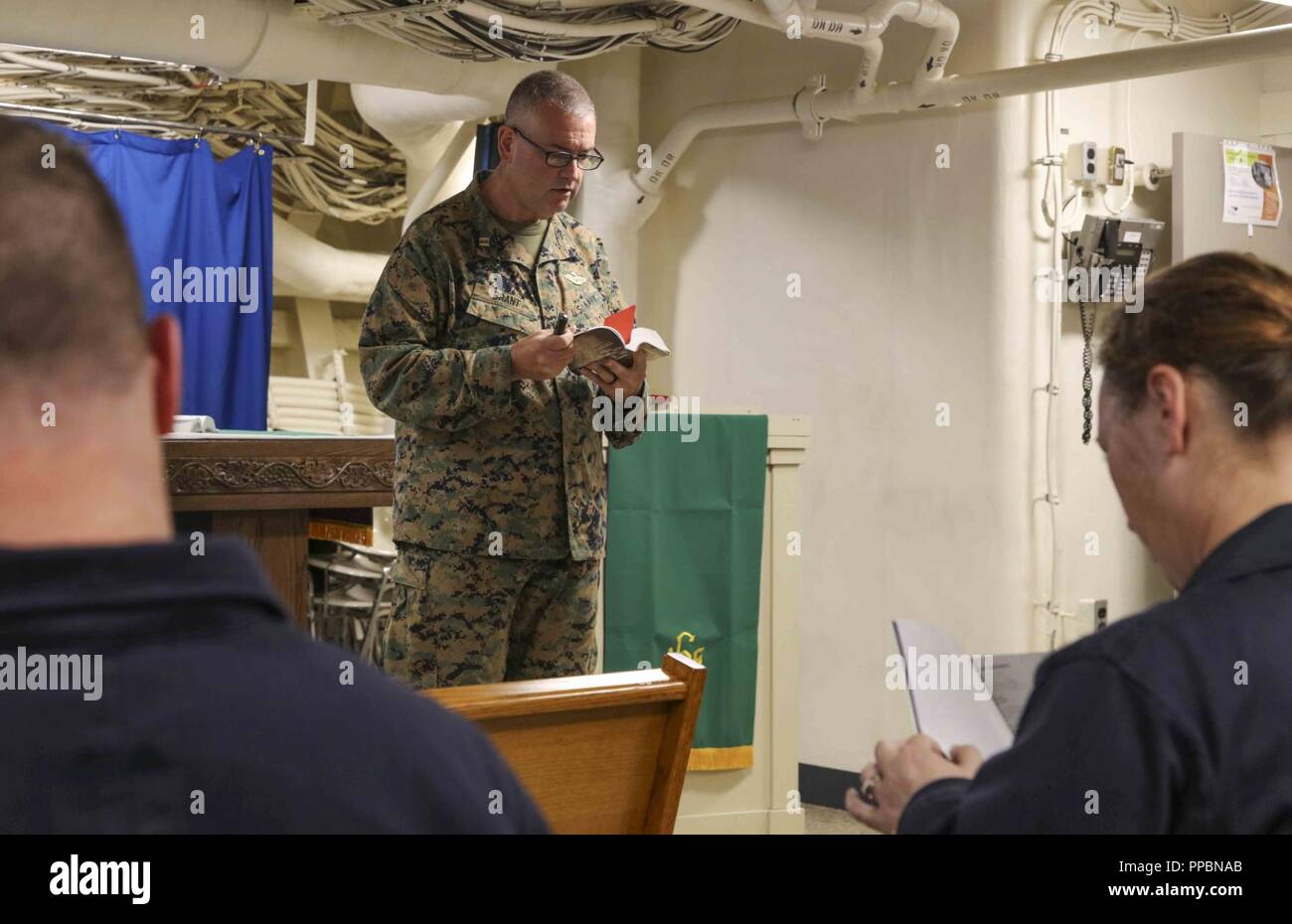 ATLANTIC OCEAN (Sep. 2, 2018) Lt. Larry Brant, chaplain, reads a bible ...