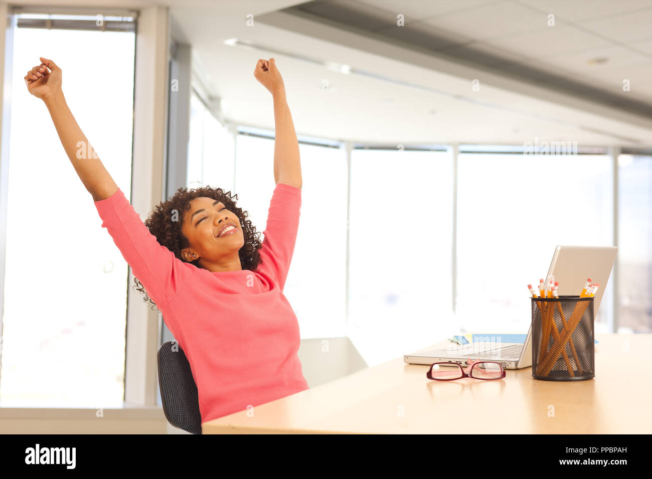 Happy millennial black businnesswoman finished with work on laptop ...