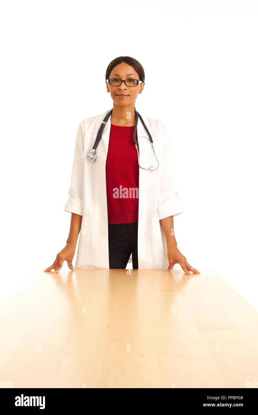 Portrait of young black medical doctor standing over table Stock Photo ...