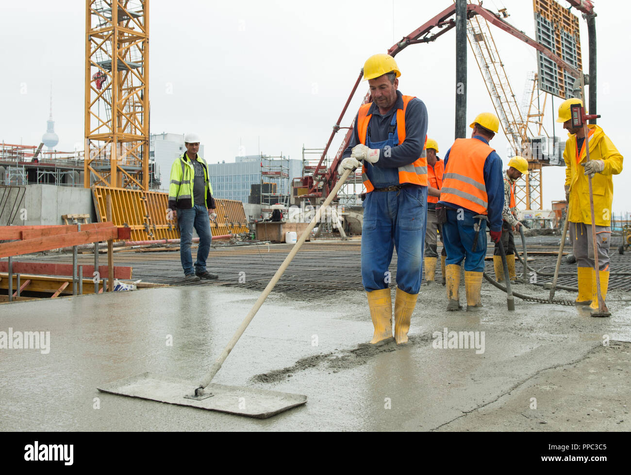Feature - Construction worker during work on the top floor of the new ...