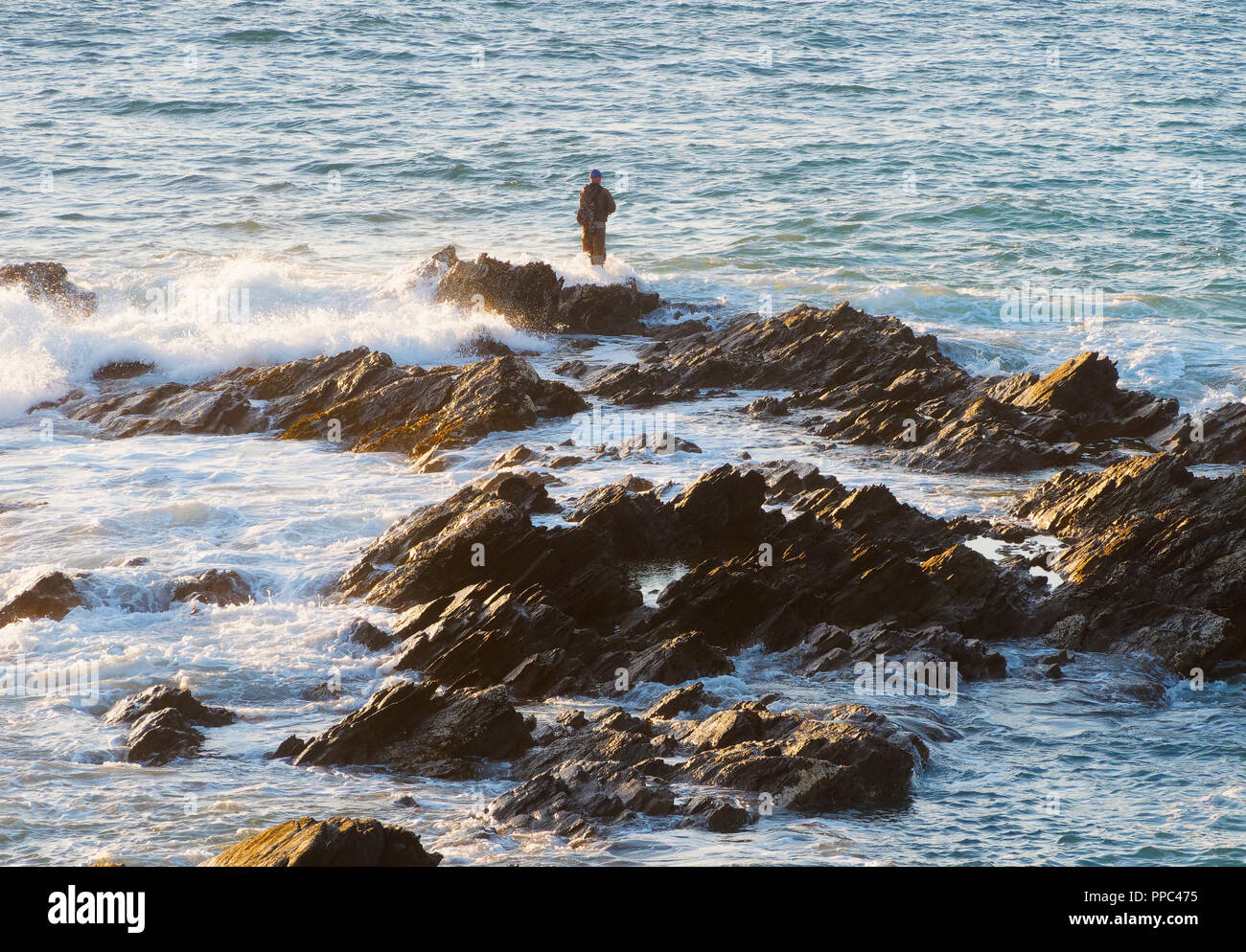 Newquay, Cornwall. 25th Sep 2018. UK Weather, Spring tide sea angler at ...