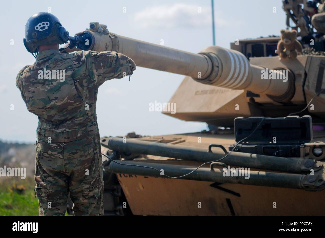 A tank crew member assigned to Alpha Company, 2nd Battalion, 8th ...