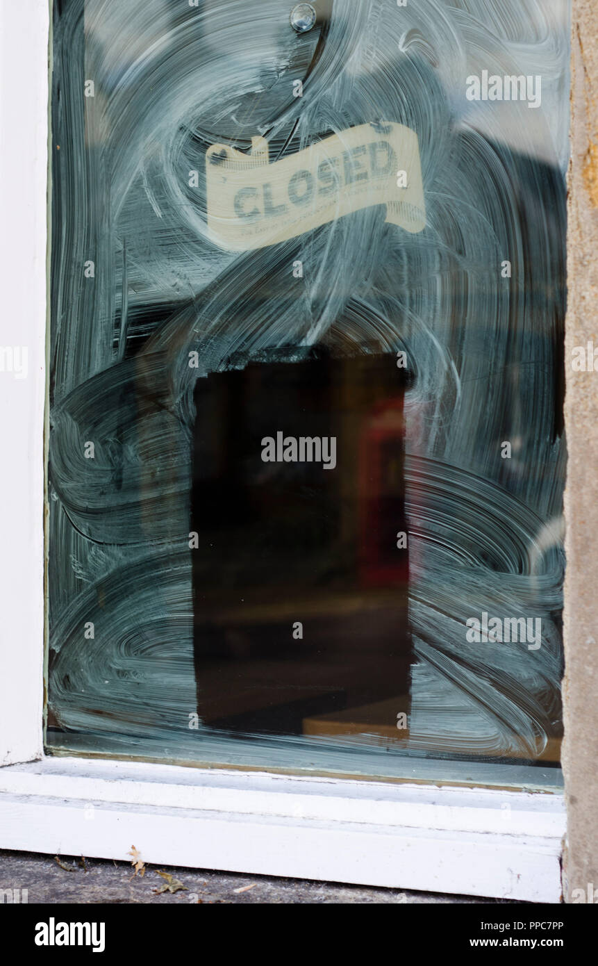 Trouble on the high street premises closed with white washed windows ...